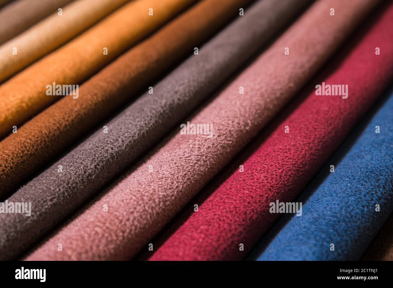Colorful and bright fabric samples of furniture and clothing upholstery ...