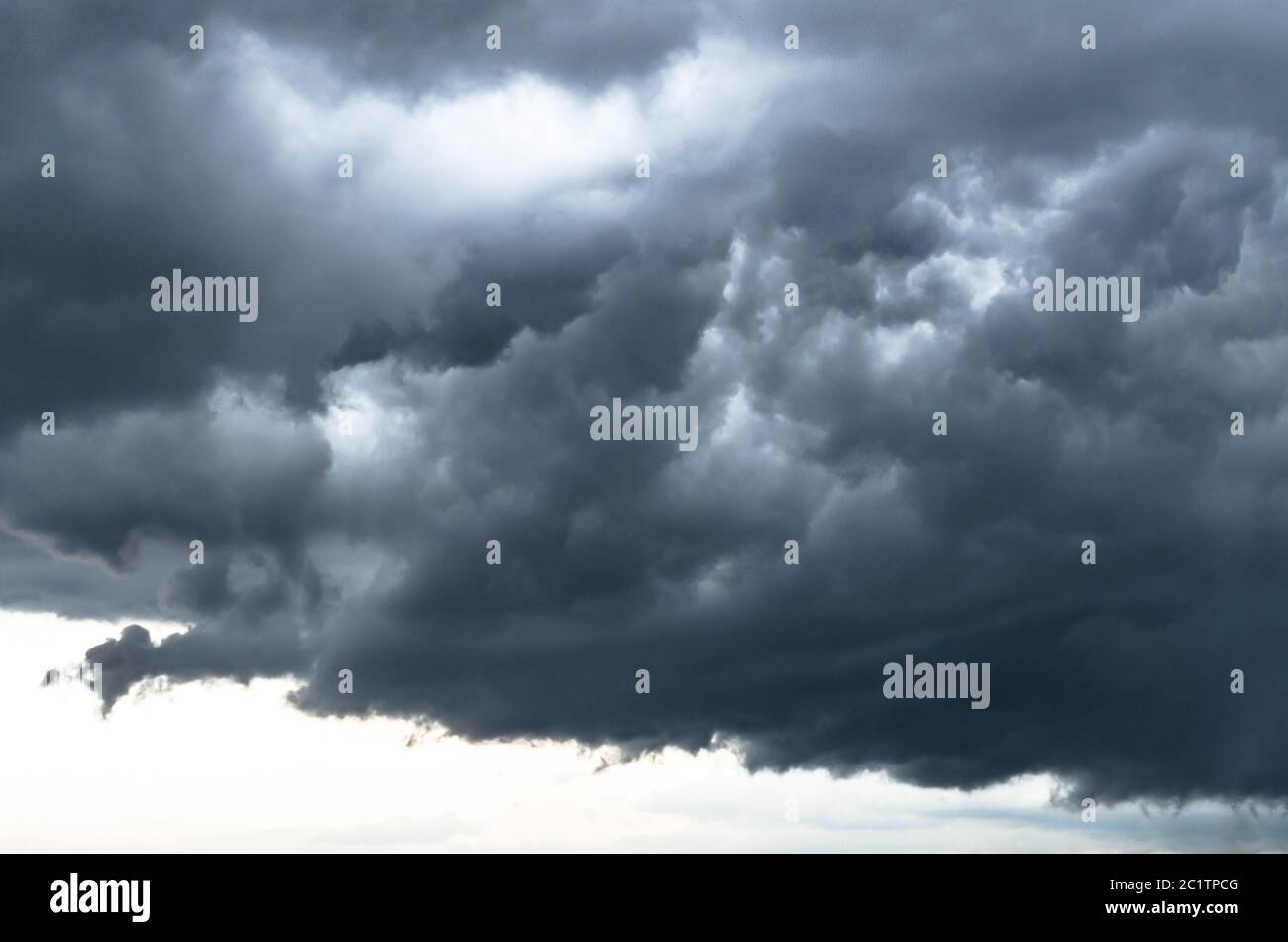 Gray textured storm clouds of bad weather, the edge of thunderstorm ...