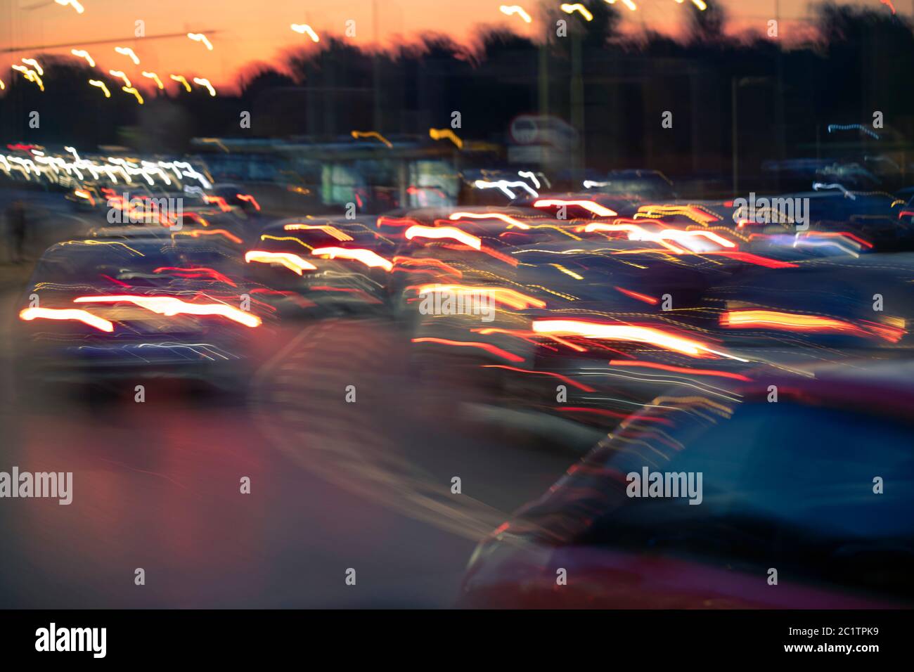Traffic jam, colorful city and cars lights, blurred by speed and motion ...