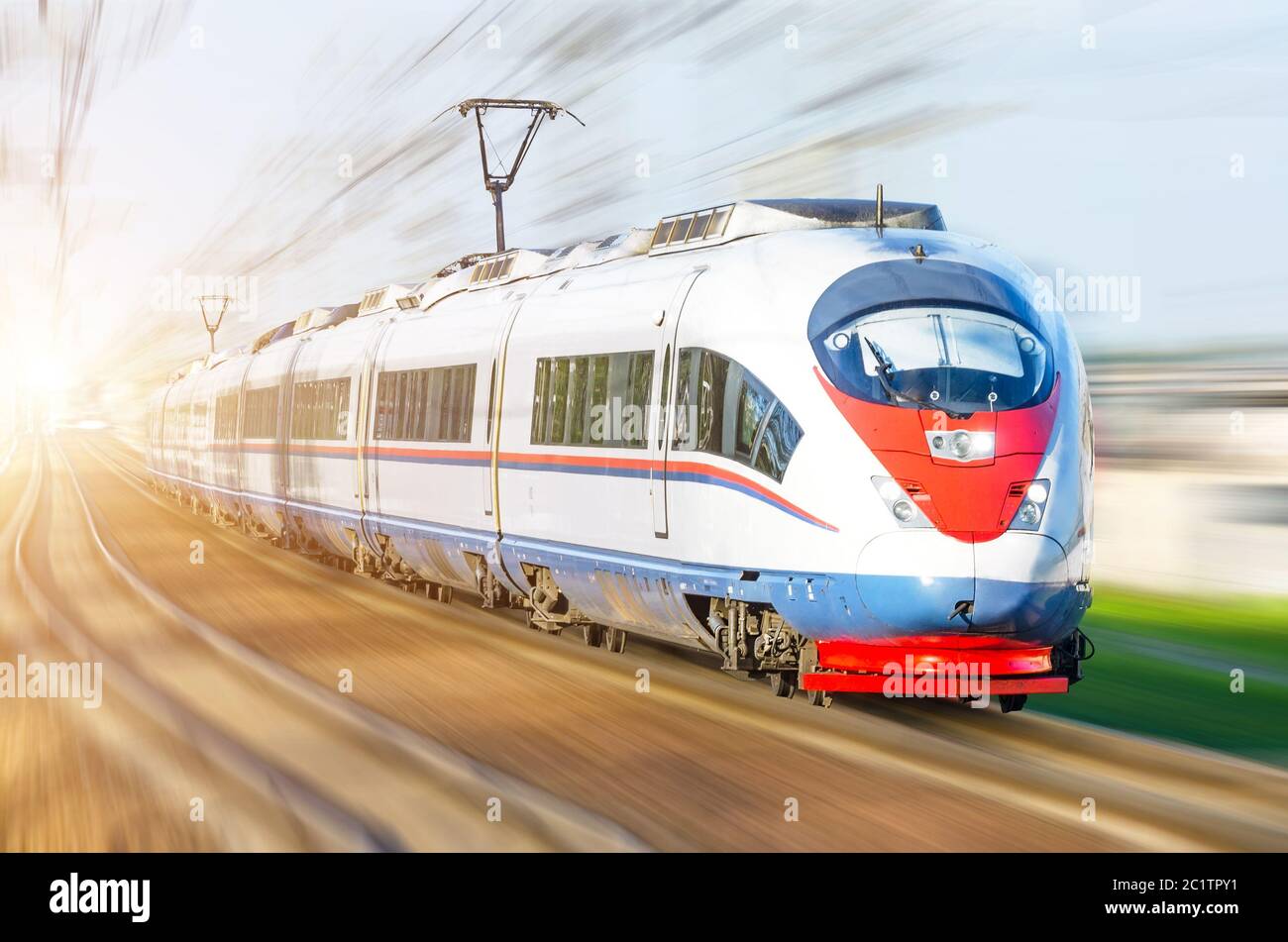 High-speed passenger train rushing through rail in Europe Stock Photo ...