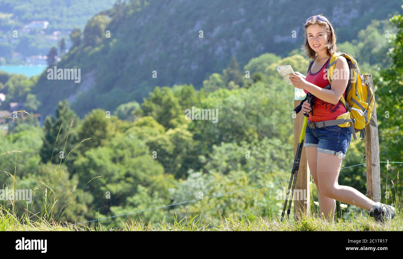 a pretty young woman looking a map in the French Alps mountains Stock ...