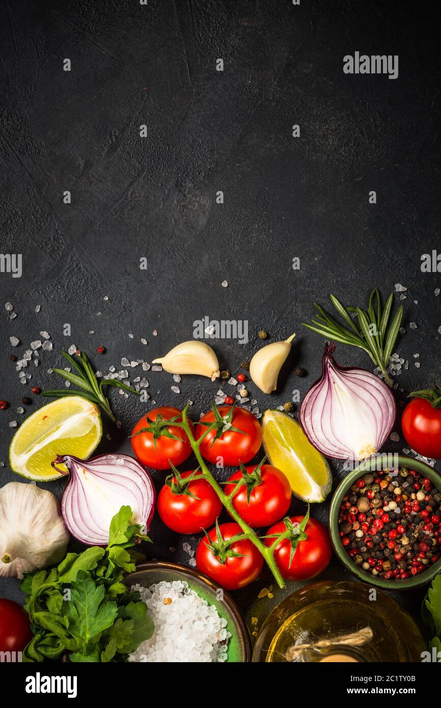 Food cooking background on black table Stock Photo - Alamy