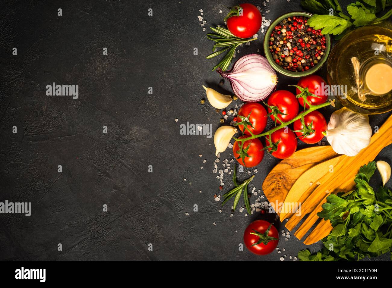 Food cooking background on black table Stock Photo - Alamy