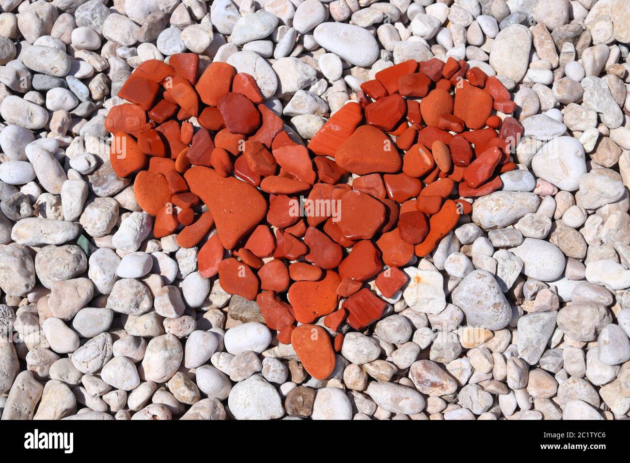 Red heart shape made of beach pebbles. Valentine's Day symbol Stock ...