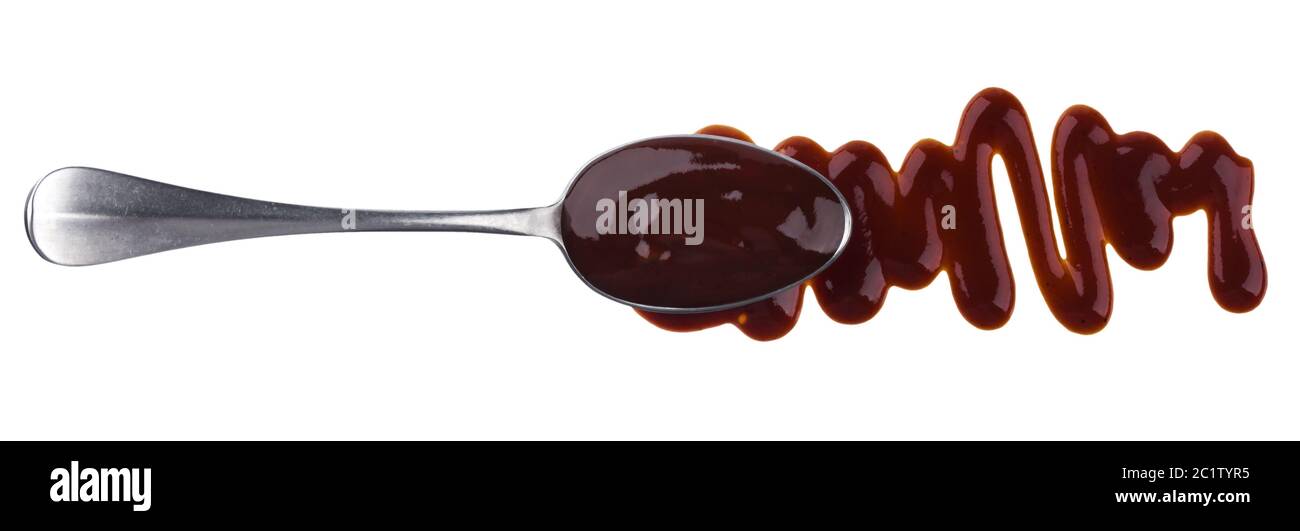 Barbecue sauce. Splashes and spilled grill sauce with spoon isolated on ...