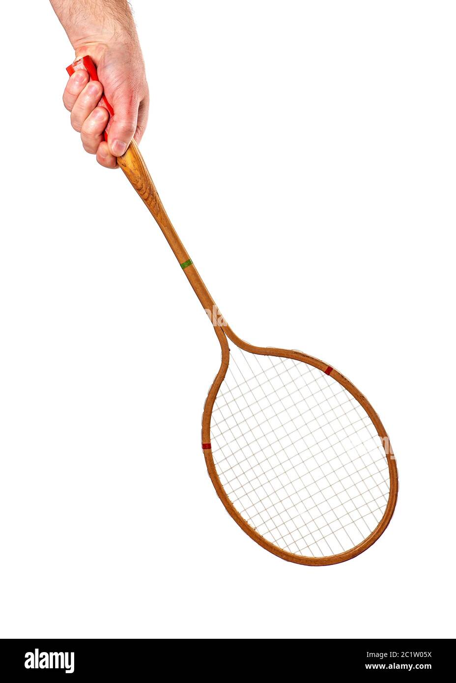 Vintage wooden badminton racket in hand isolated on white background ...