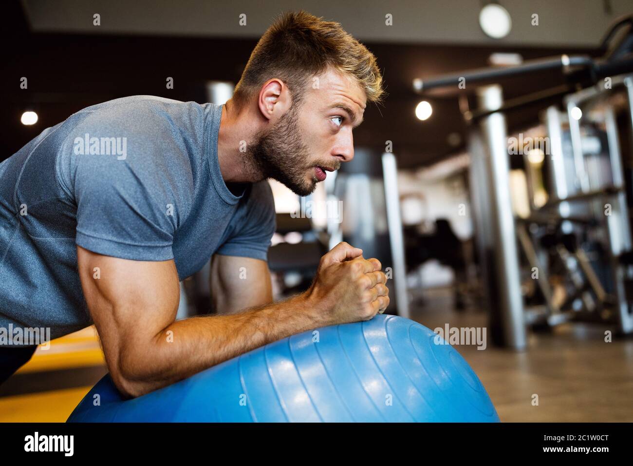 Strong guy doing hard exercises hi-res stock photography and images - Alamy