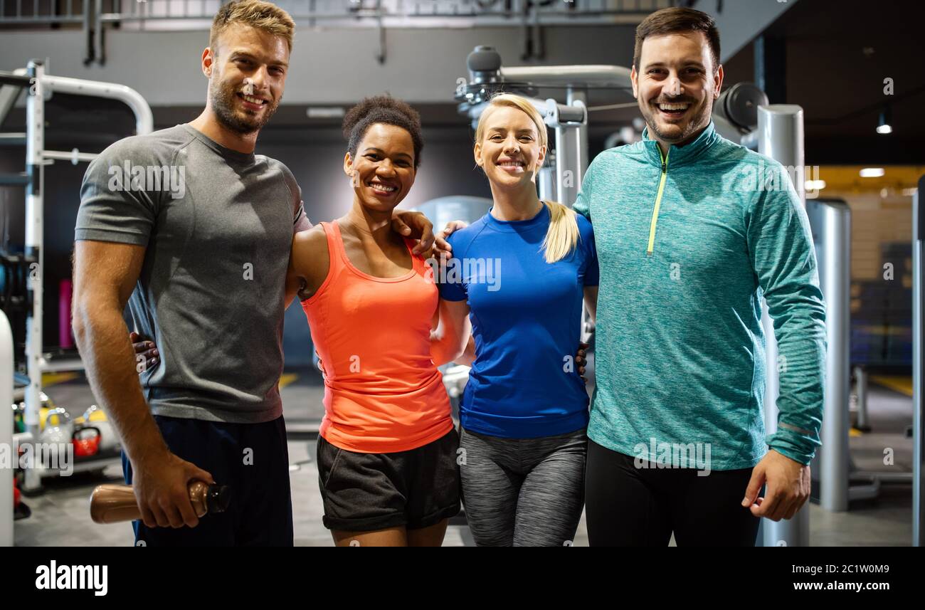 Group of friends smiling and enjoy sport in gym Stock Photo - Alamy