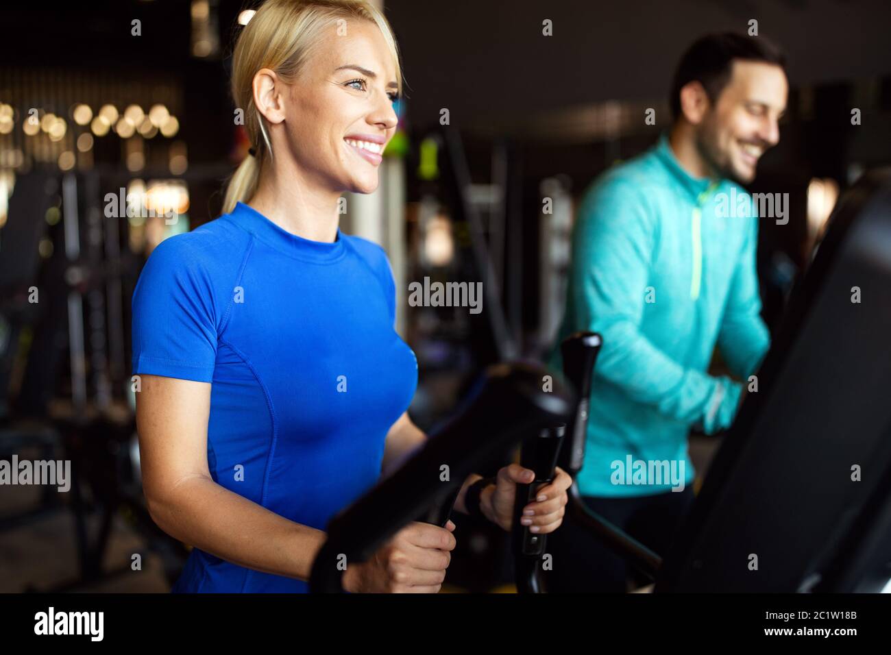 Group of fit people in gym training. Multiracial group of friends ...