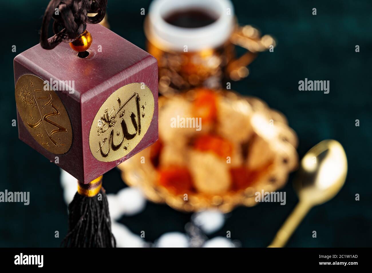 Muslim amulet of bordeux color on rope Stock Photo - Alamy