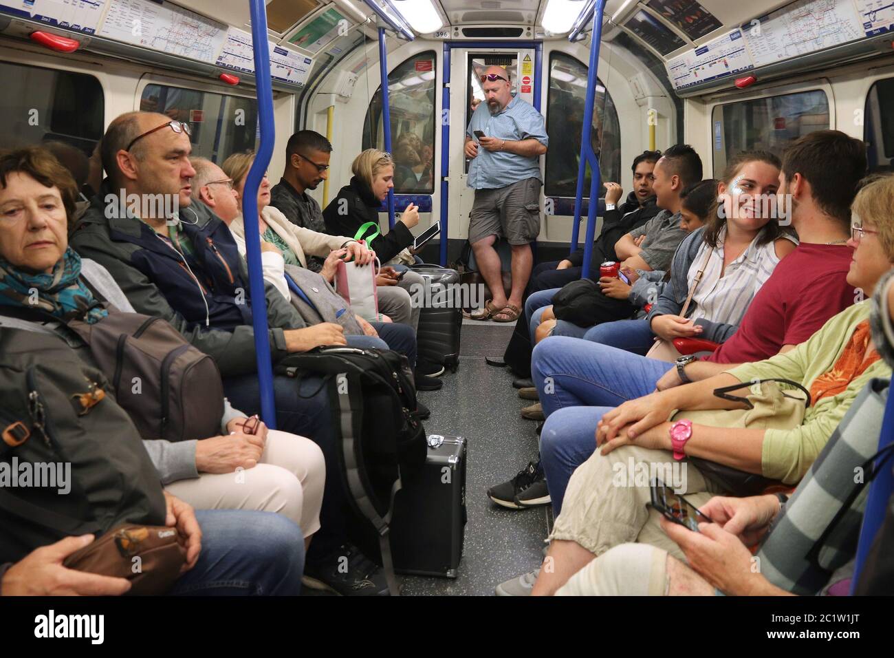 LONDON, UK - JULY 14, 2019: Passengers ride London Underground train ...