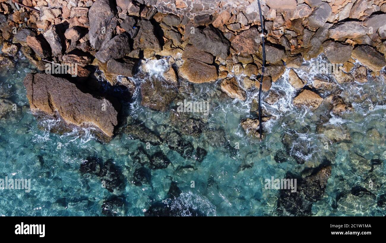 Aerial view of the rocky coast of the island of Mallorca with waves ...