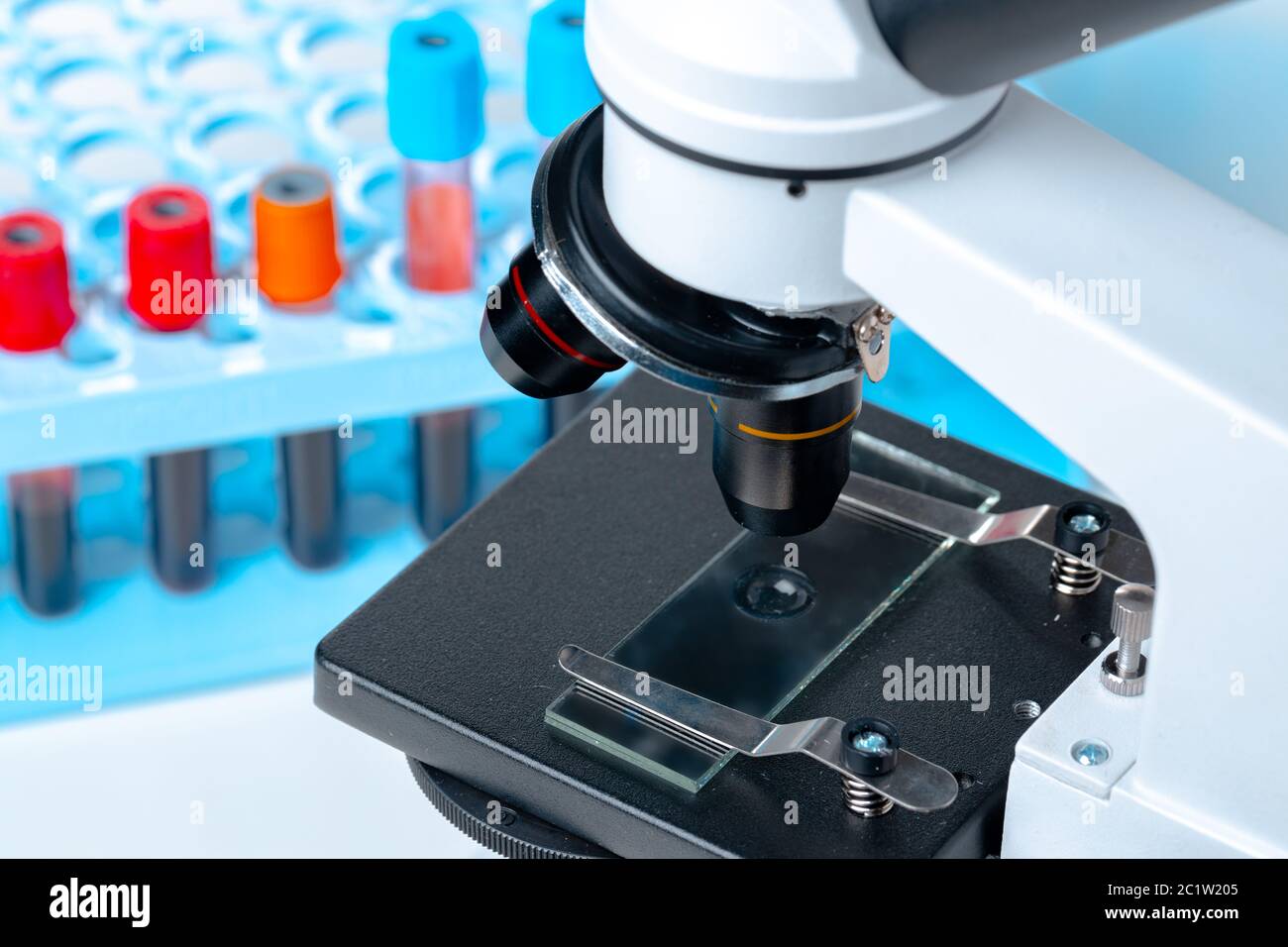Microscope with test tubes for research close up Stock Photo - Alamy