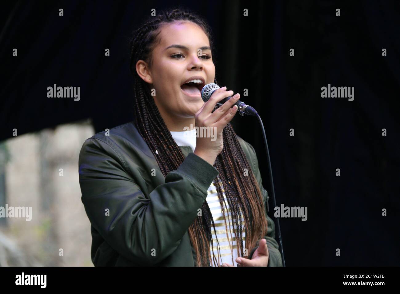 Pictured: Singer/songwriter Mi-kaisha performs on stage Stock Photo - Alamy