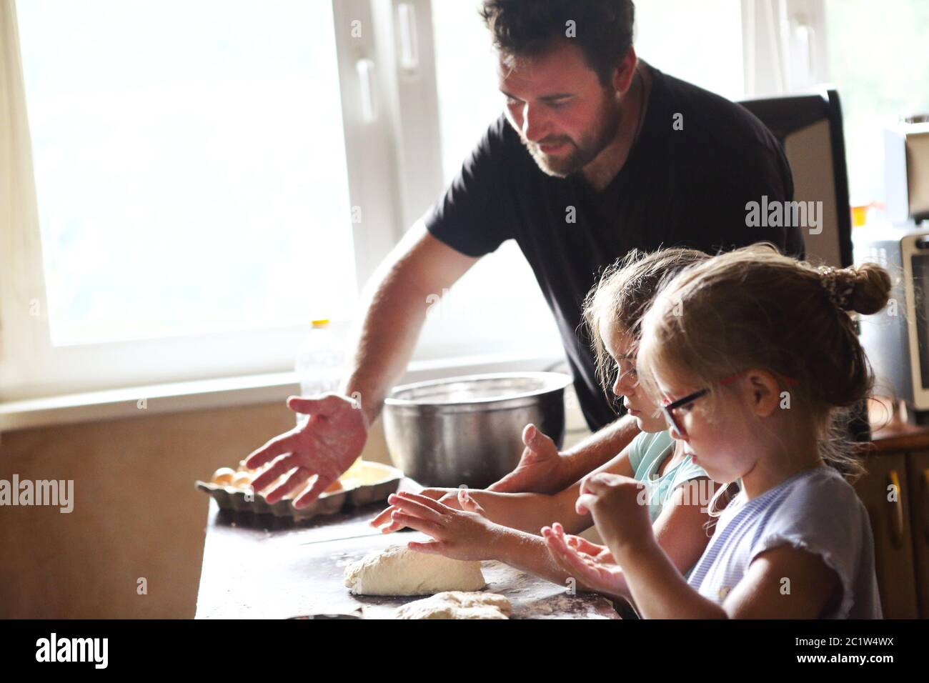 Children cooking homemade bread with there father Stock Photo - Alamy