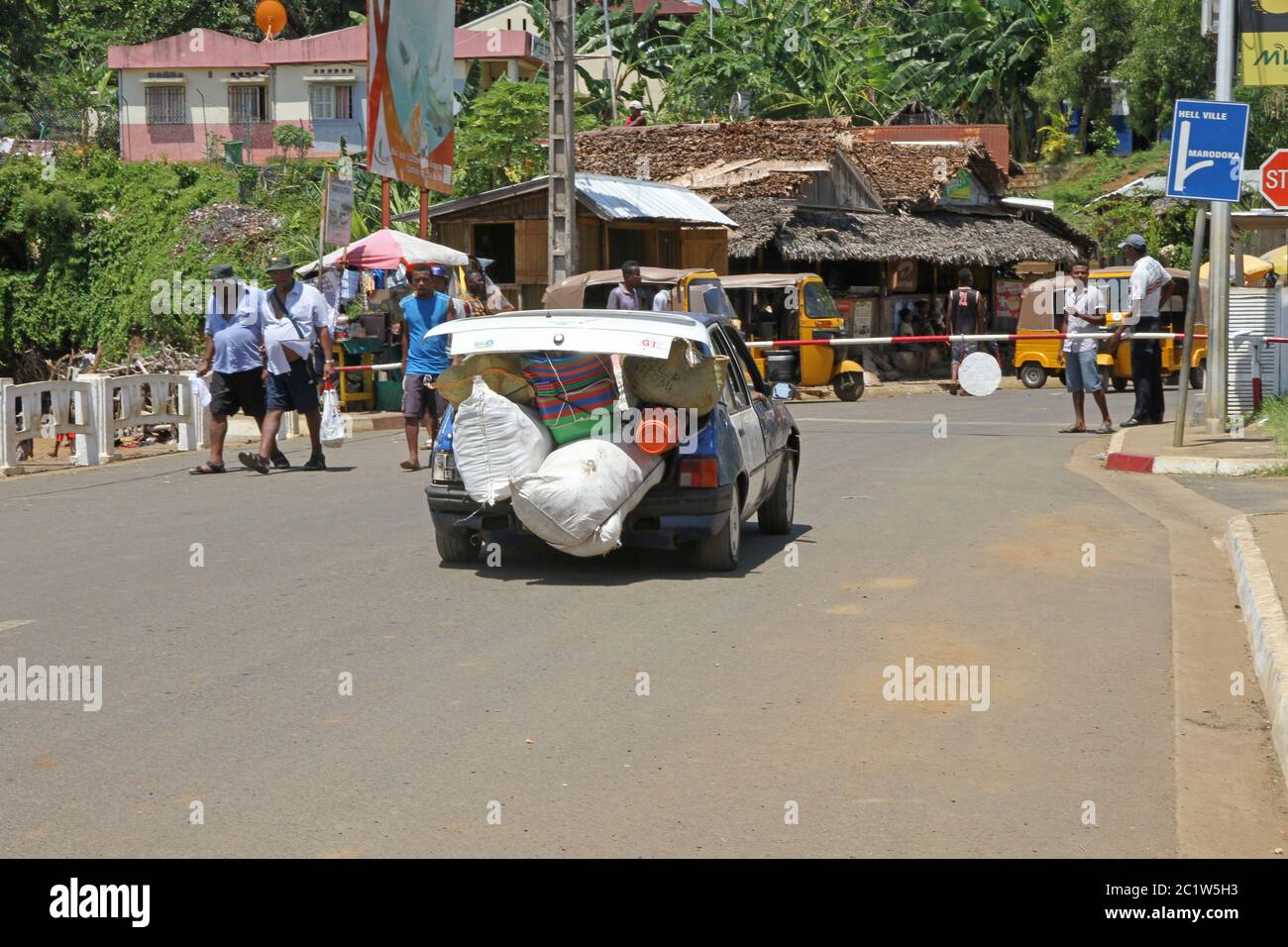 Road traffic control ramp at the entrance of Andoany or Hell-Ville ...