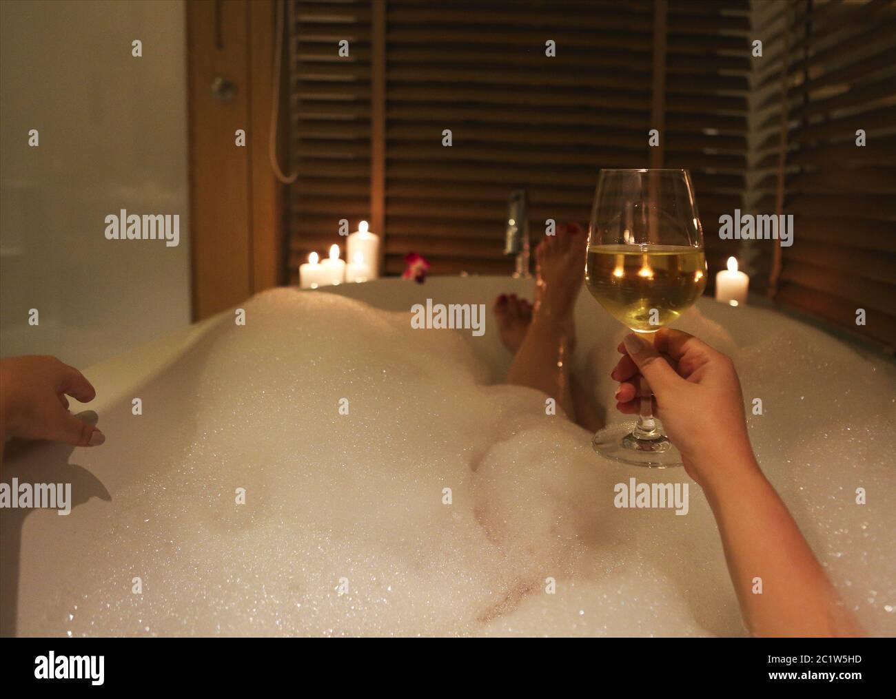 Woman with champagne in bathroom hi-res stock photography and images ...