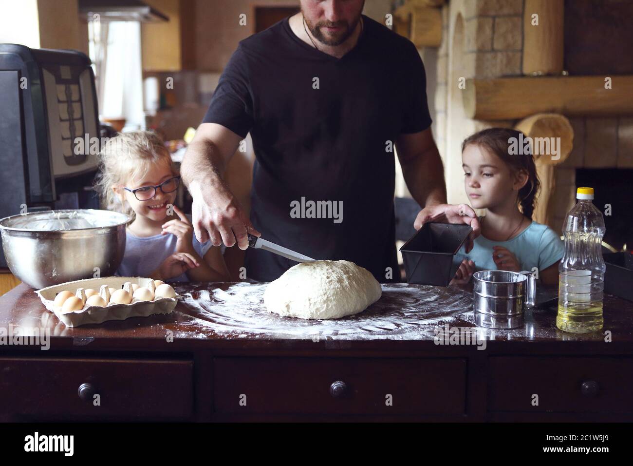 Children cooking homemade bread with there father Stock Photo - Alamy