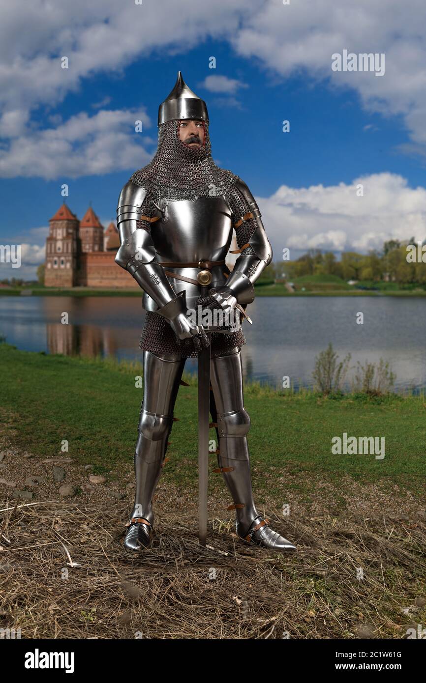 Mannequin with a beard in a helmet and armor of a knight posing on a ...