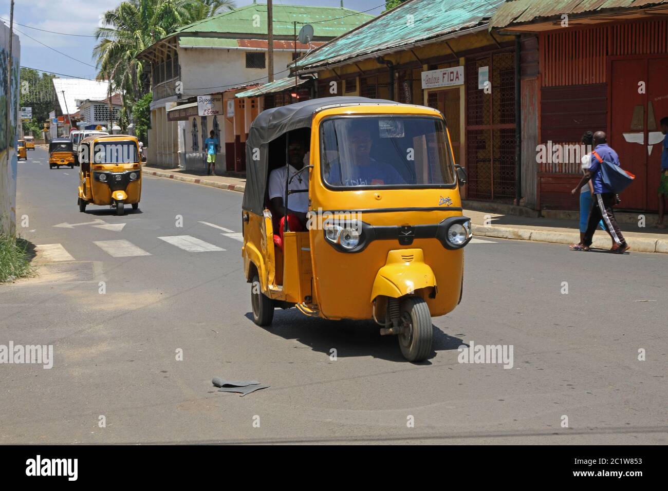 Tuk-tuk taxis on street, Andoany/Hell-Ville City, Madagascar Stock ...