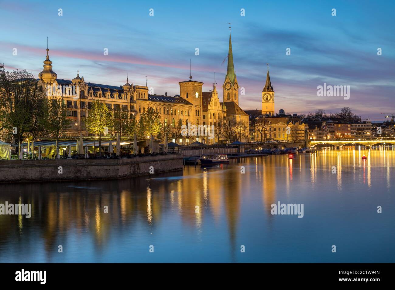 Views of the Zurich Skyline at sunset-blue hour. The Fraumünster and St ...