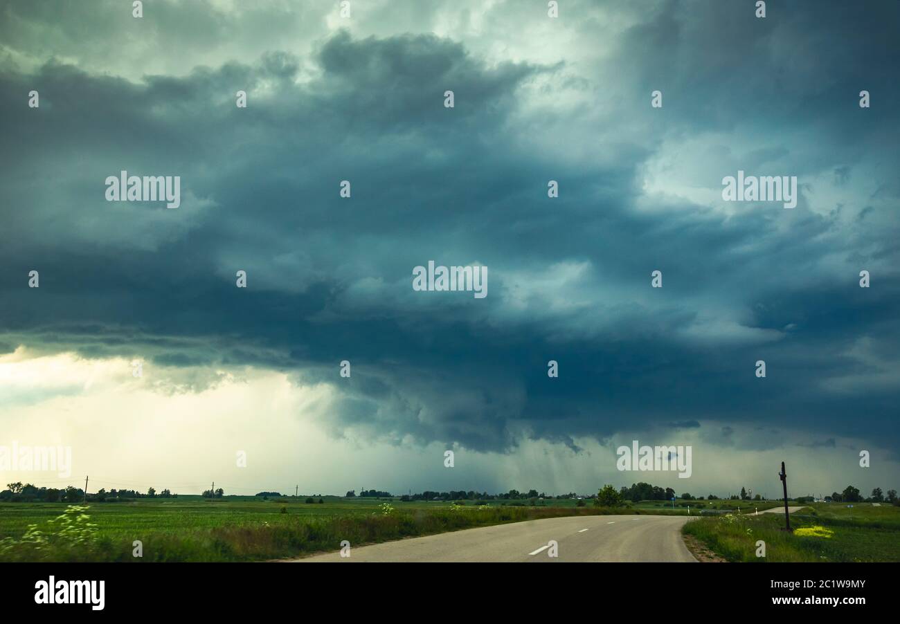 Supercell storm clouds with wall cloud and intense rain Stock Photo - Alamy