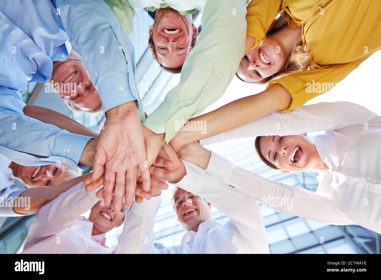 Cooperation and collaboration among business team with many stacked ...