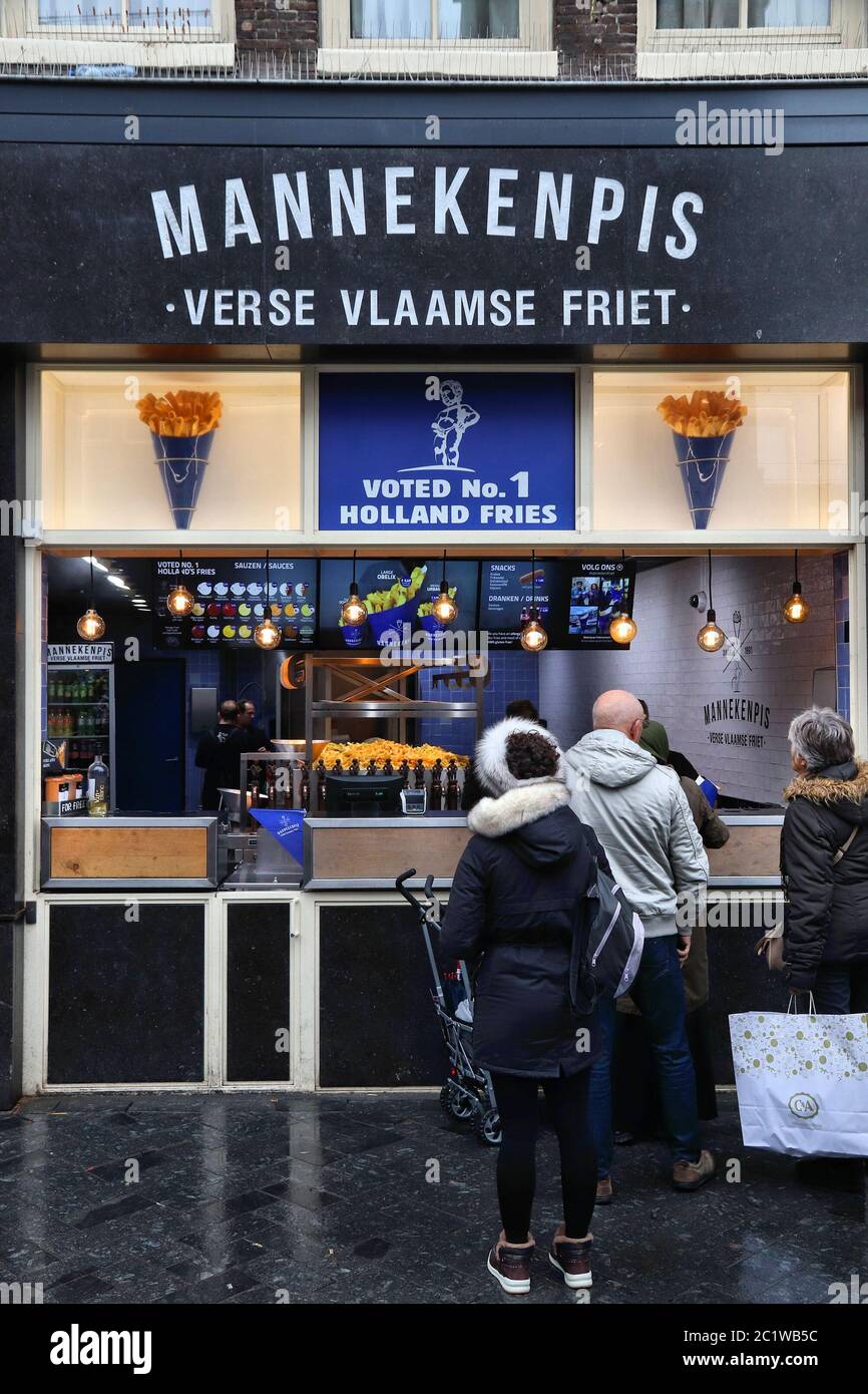 AMSTERDAM, NETHERLANDS - DECEMBER 6, 2018: People wait to buy Belgian ...