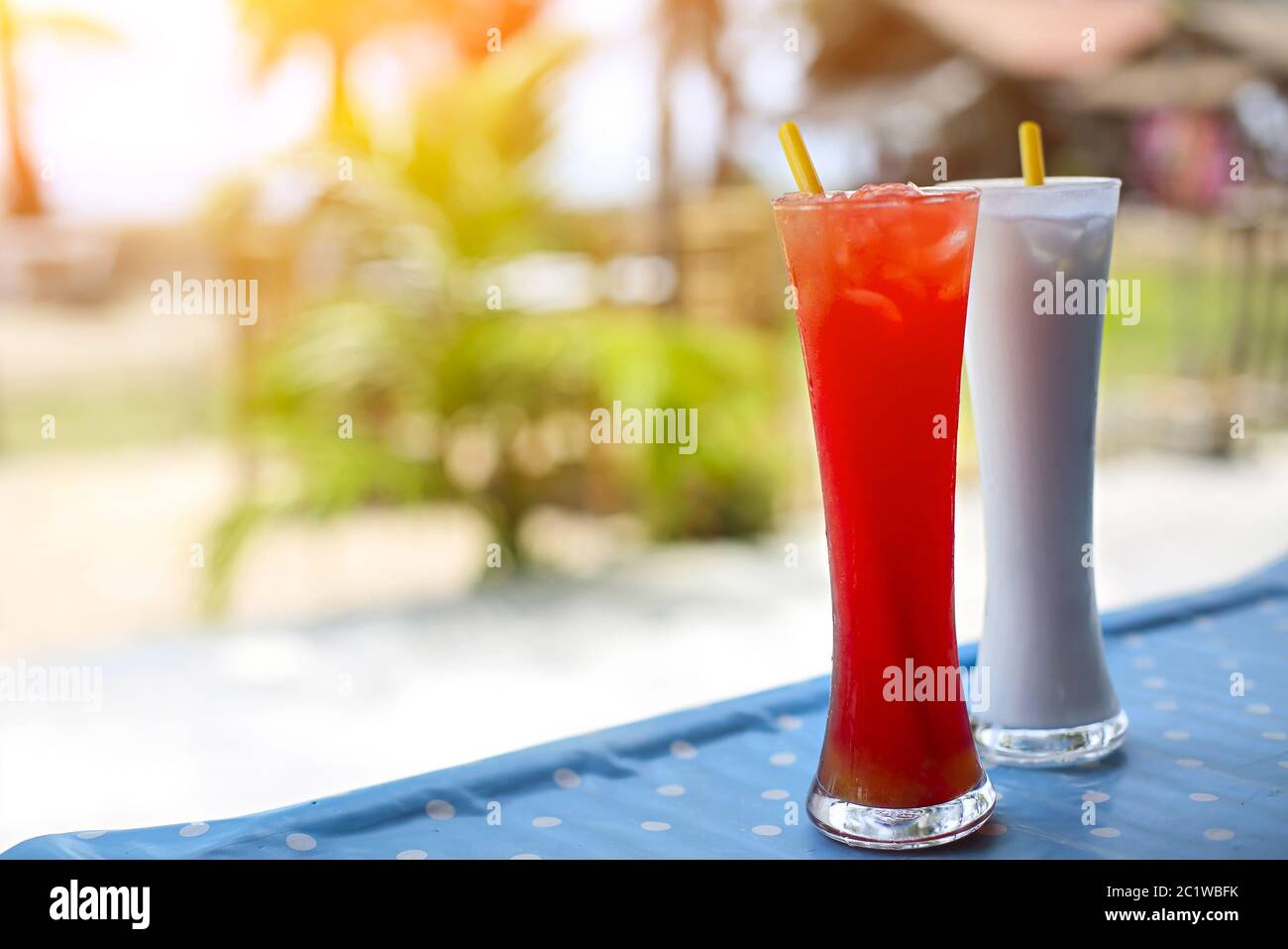 Tequila sunrise and pina colada cocktails on the table Stock Photo - Alamy