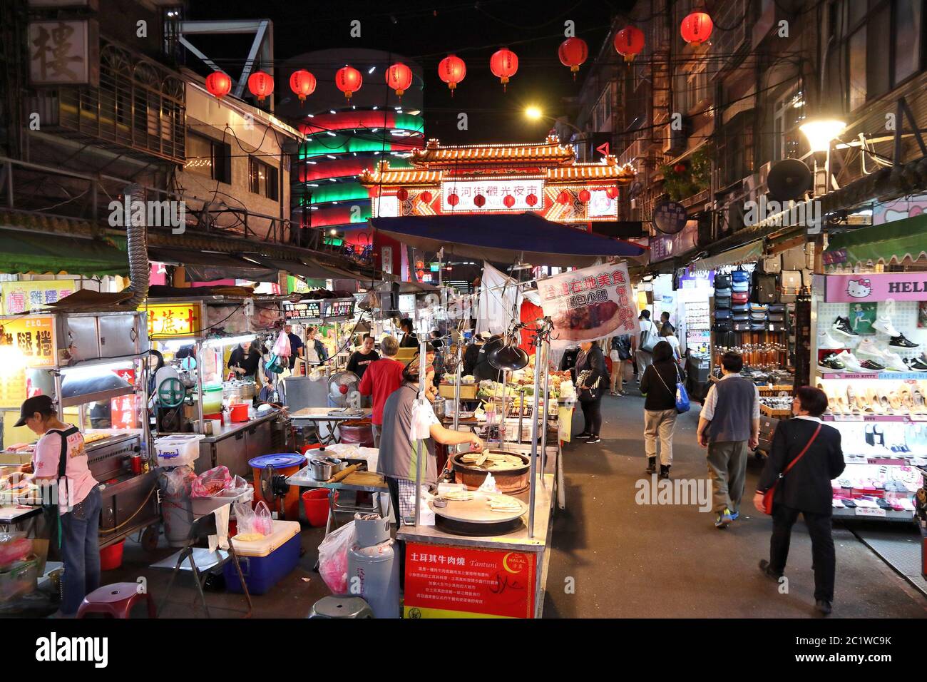 TAIPEI, TAIWAN - DECEMBER 4, 2018: People visit Raohe Street Night Market in Taipei. Night food ...