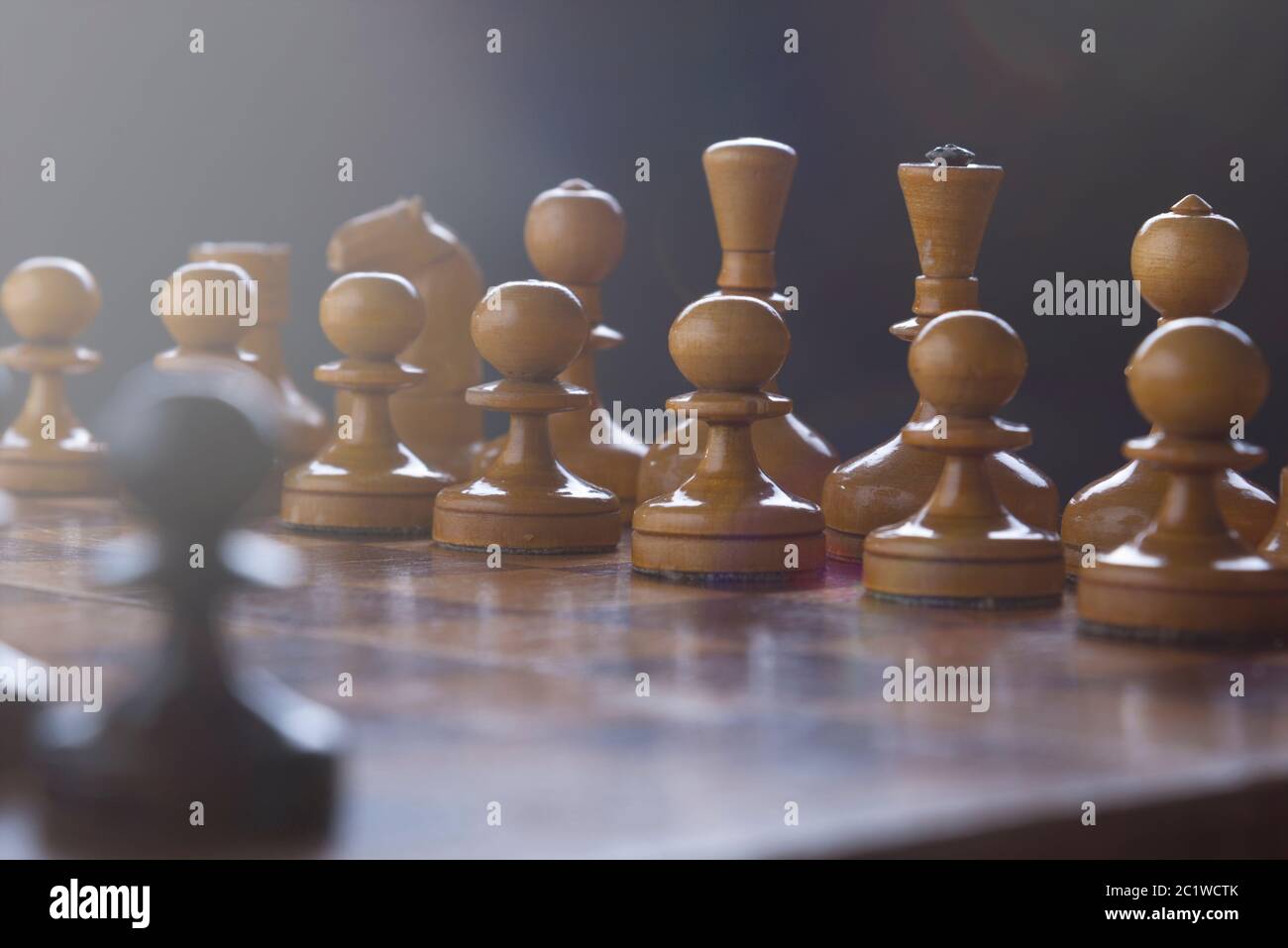 chess on a chessboard, black pawn against an army of white Stock Photo ...