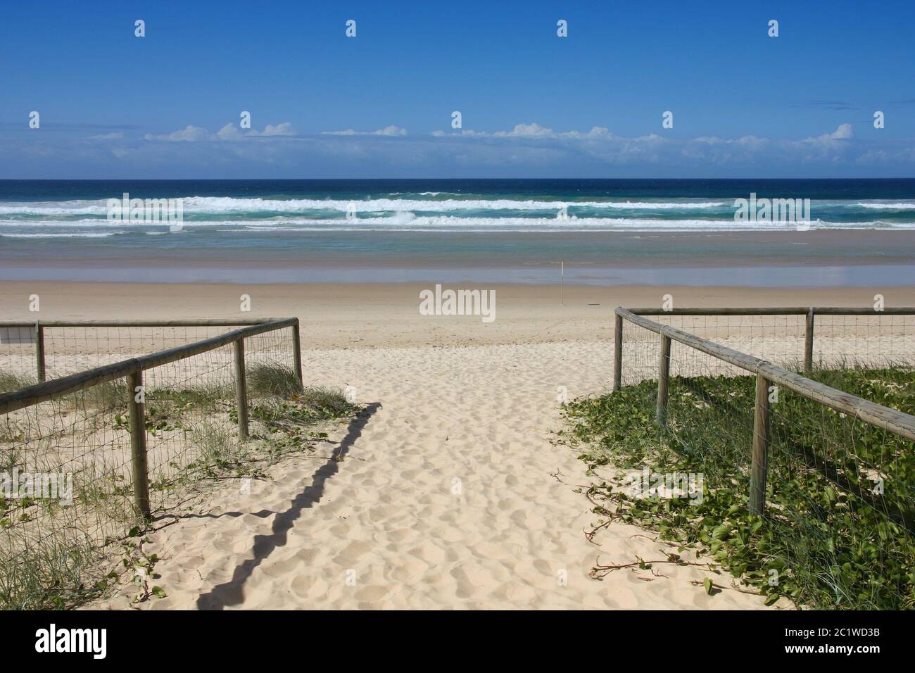 Sandy beach entrance path in Surfers Paradise city, Gold Coast region ...