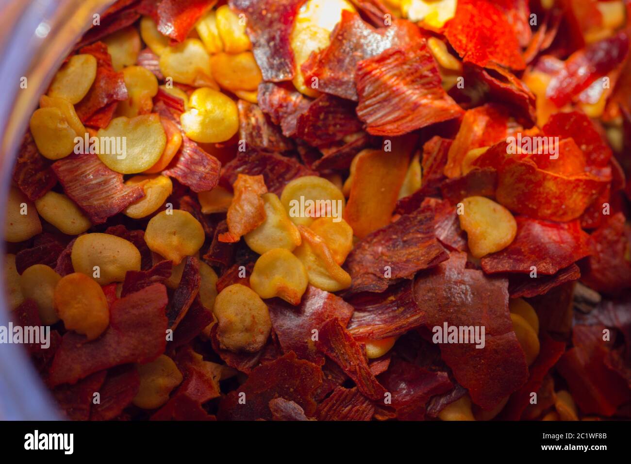 Red chili flakes in a glass jar Stock Photo - Alamy