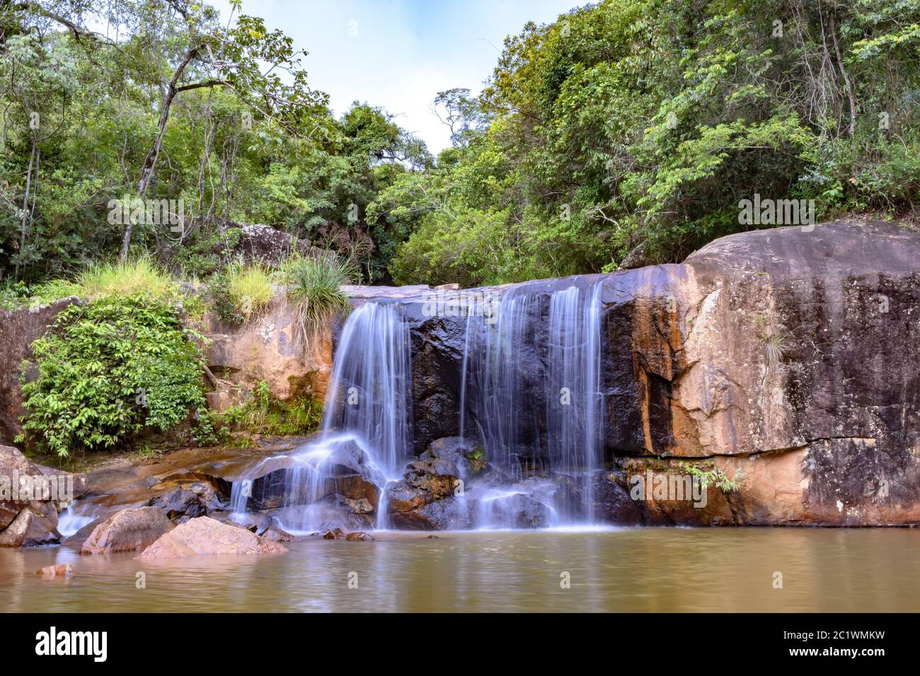 Cascade in the rain forest between stones Stock Photo - Alamy
