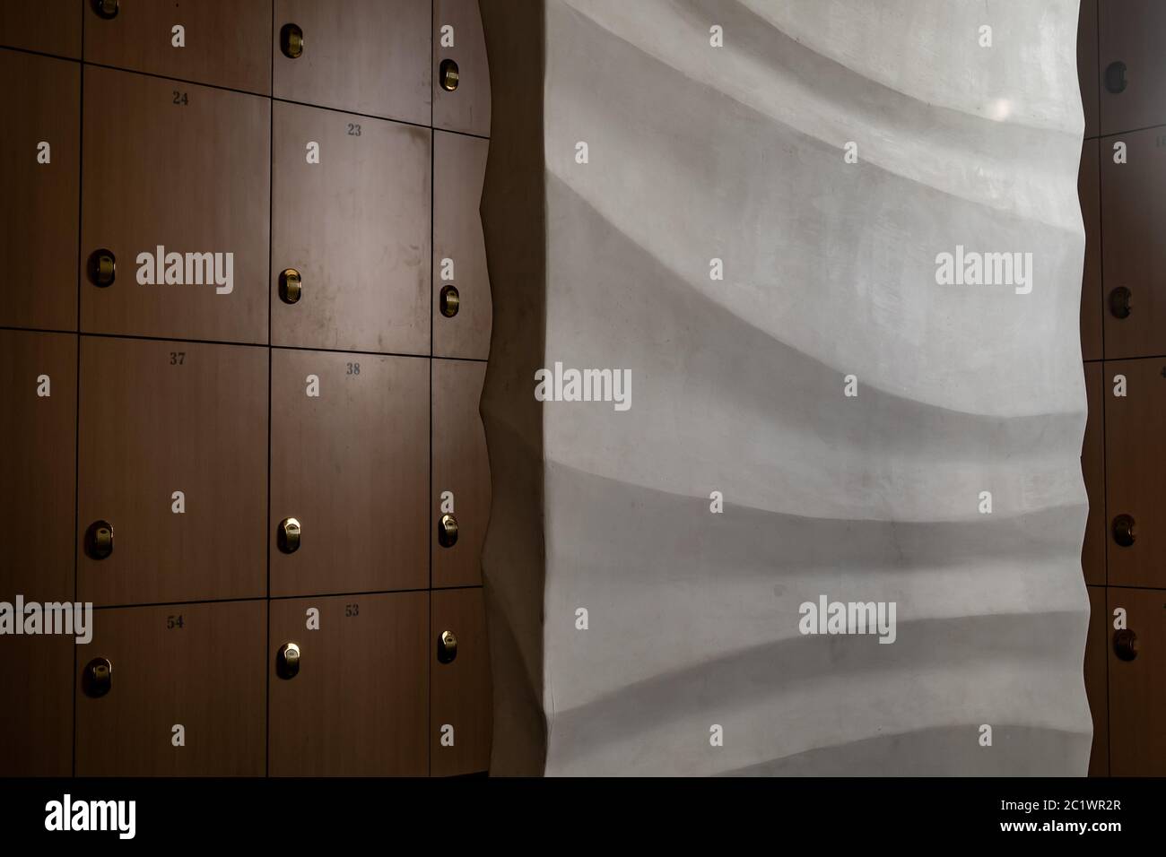 Fitness gym room locker with shift electronic lock on wooden wall ...