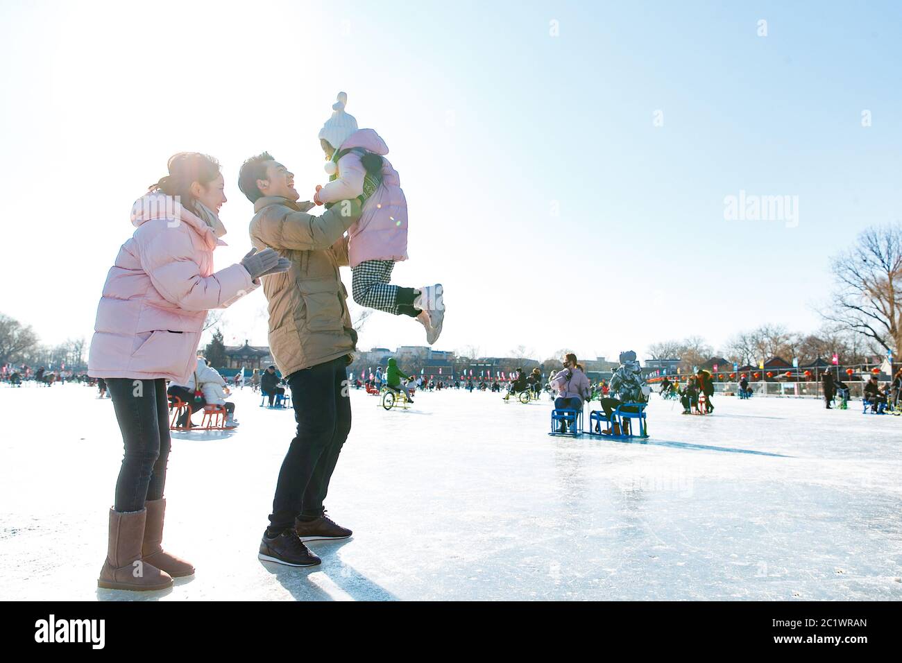 The three playing skating rink Stock Photo - Alamy