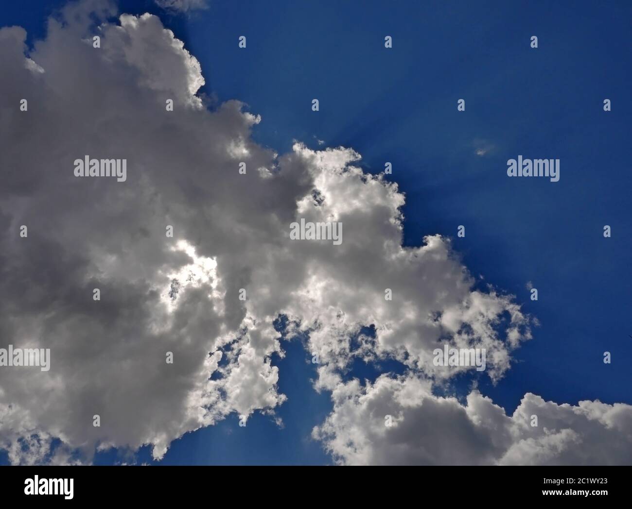 clouds blue sky sun ray, natural landscape Stock Photo - Alamy