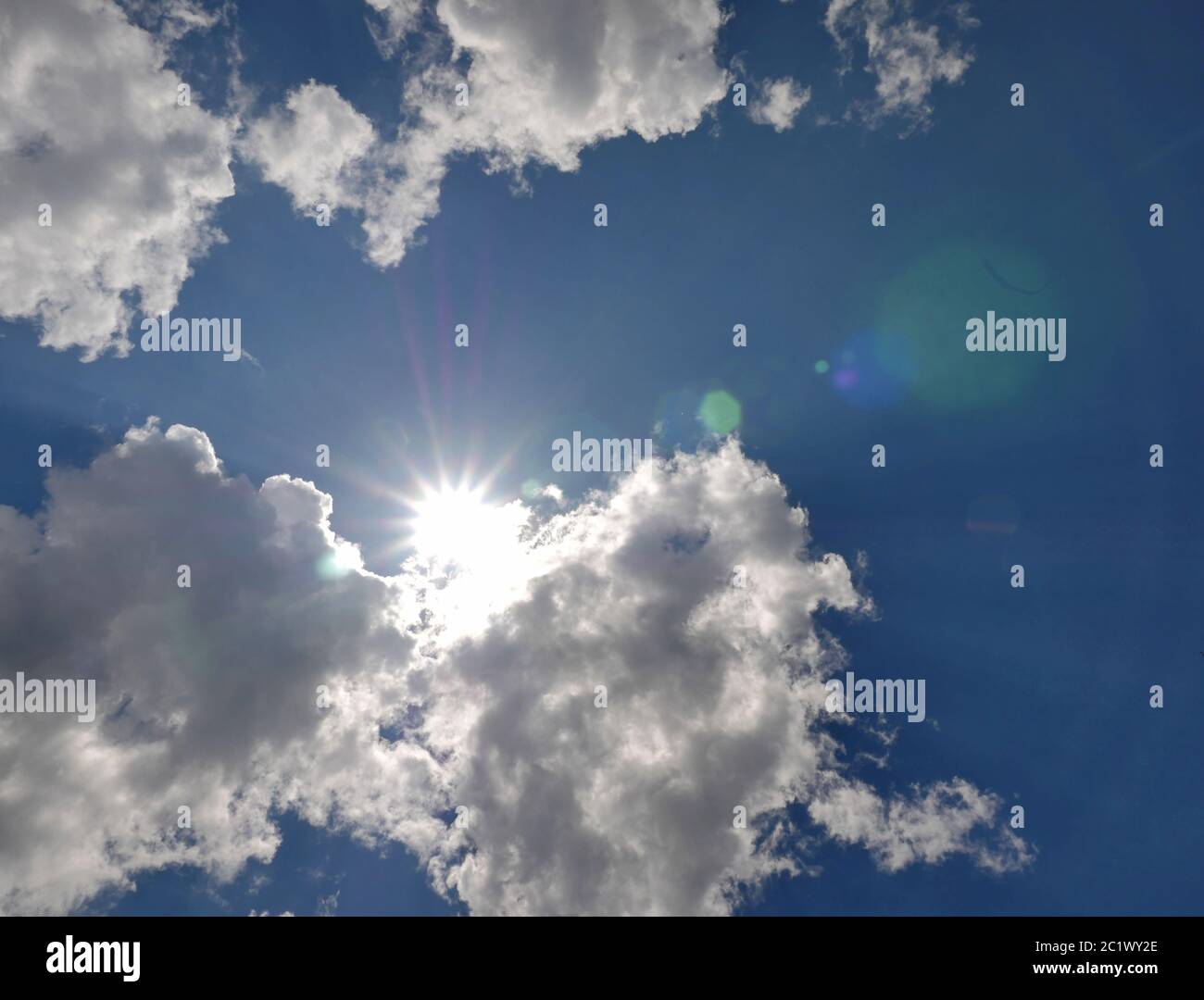 clouds blue sky sun ray, natural landscape Stock Photo - Alamy