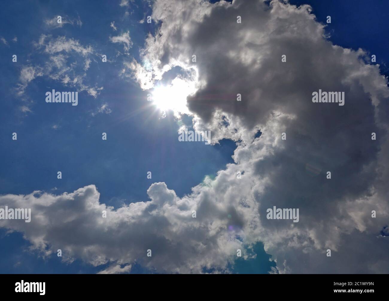 clouds blue sky sun ray, natural landscape Stock Photo - Alamy