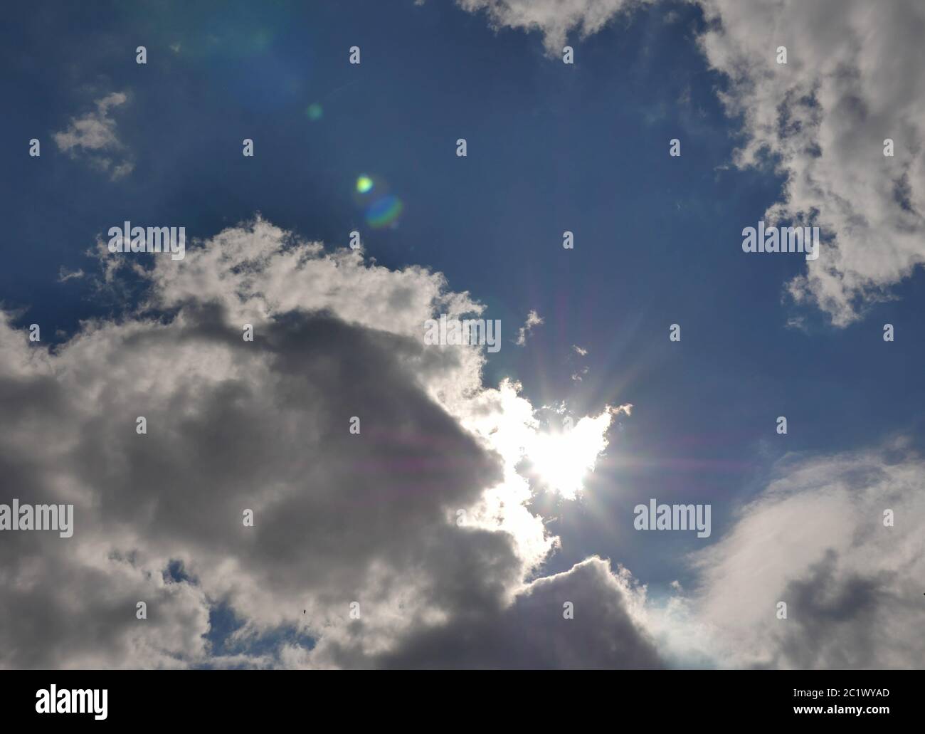 clouds blue sky sun ray, natural landscape Stock Photo - Alamy