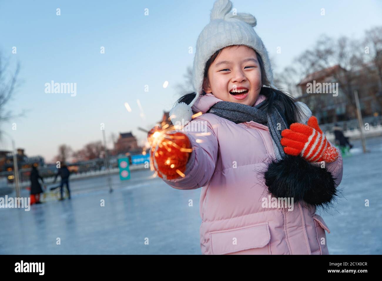 Happy little girl with fireworks Stock Photo - Alamy