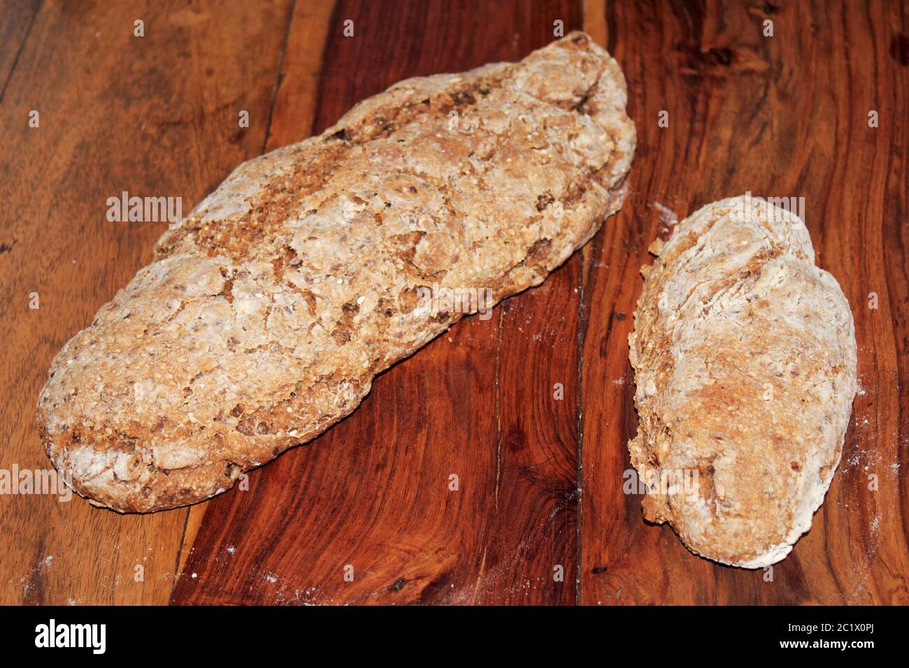 Breads on wooden table Stock Photo - Alamy