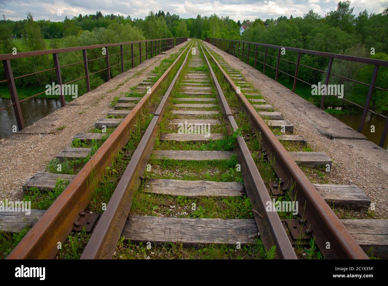 An old Abandoned railway, overgrown with green grass Stock Photo - Alamy