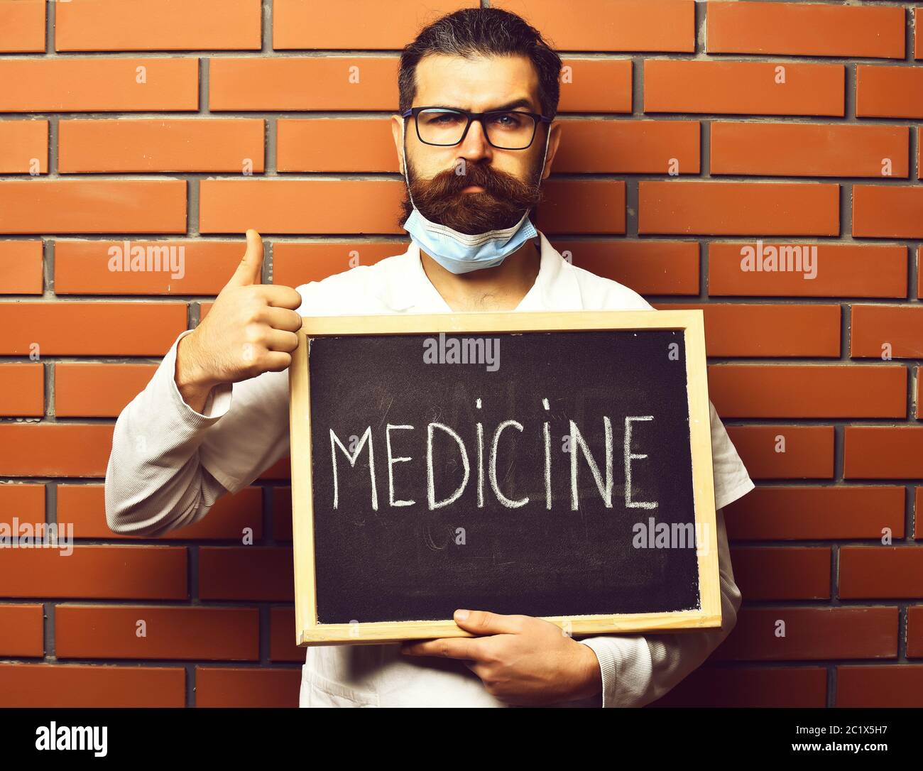 Bearded man, long beard. Brutal caucasian doctor or unshaven hipster ...