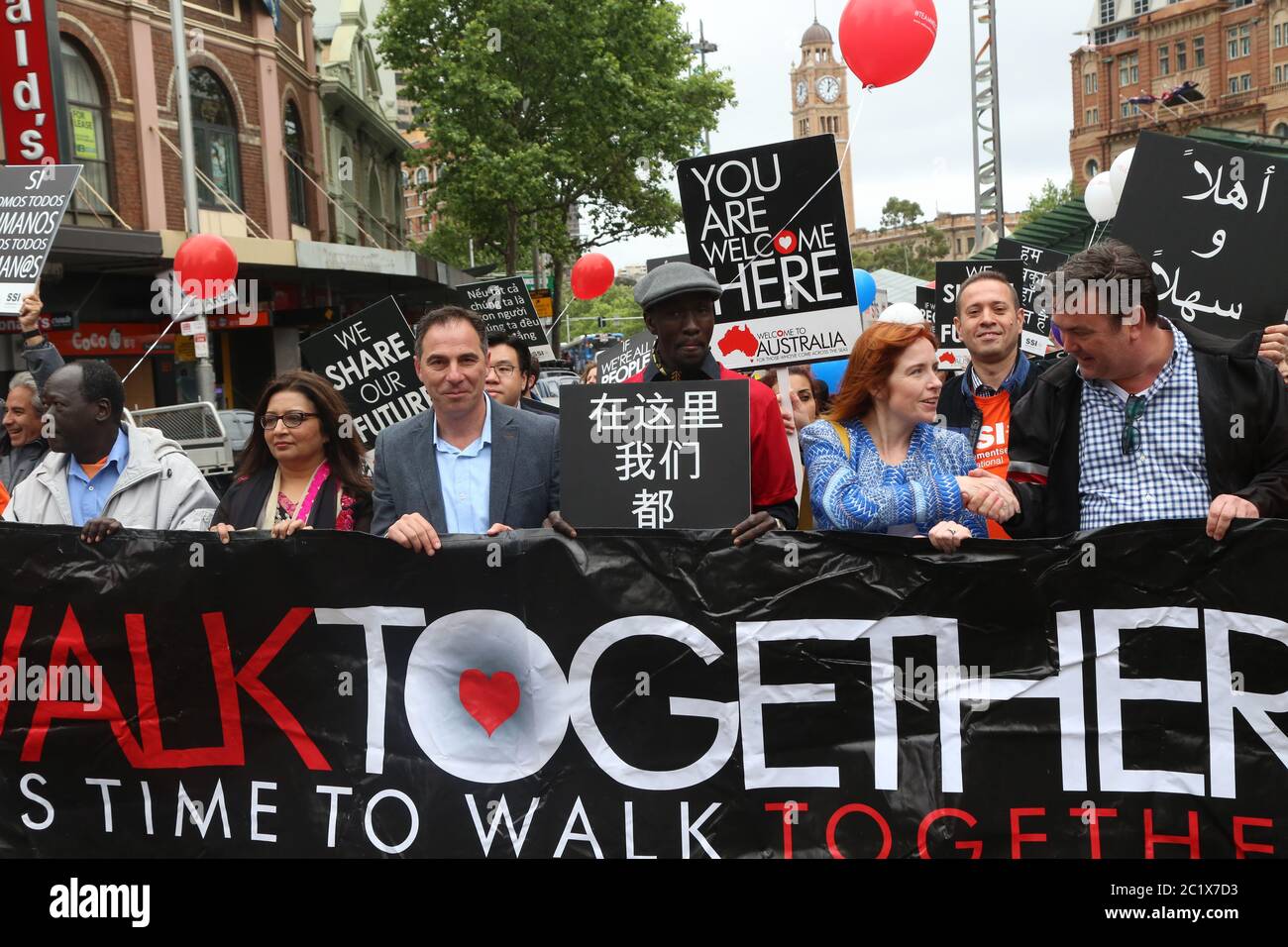 Pictured: Walkers make their way along Broadway to Victoria Park led by ...