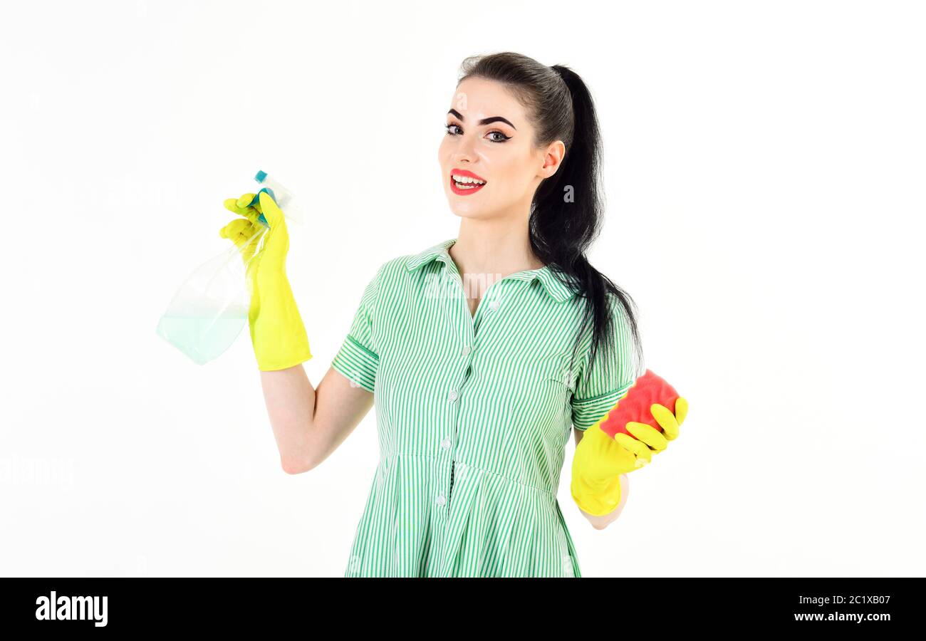 Young smiling cleaner woman looks happy. Isolated over white background ...