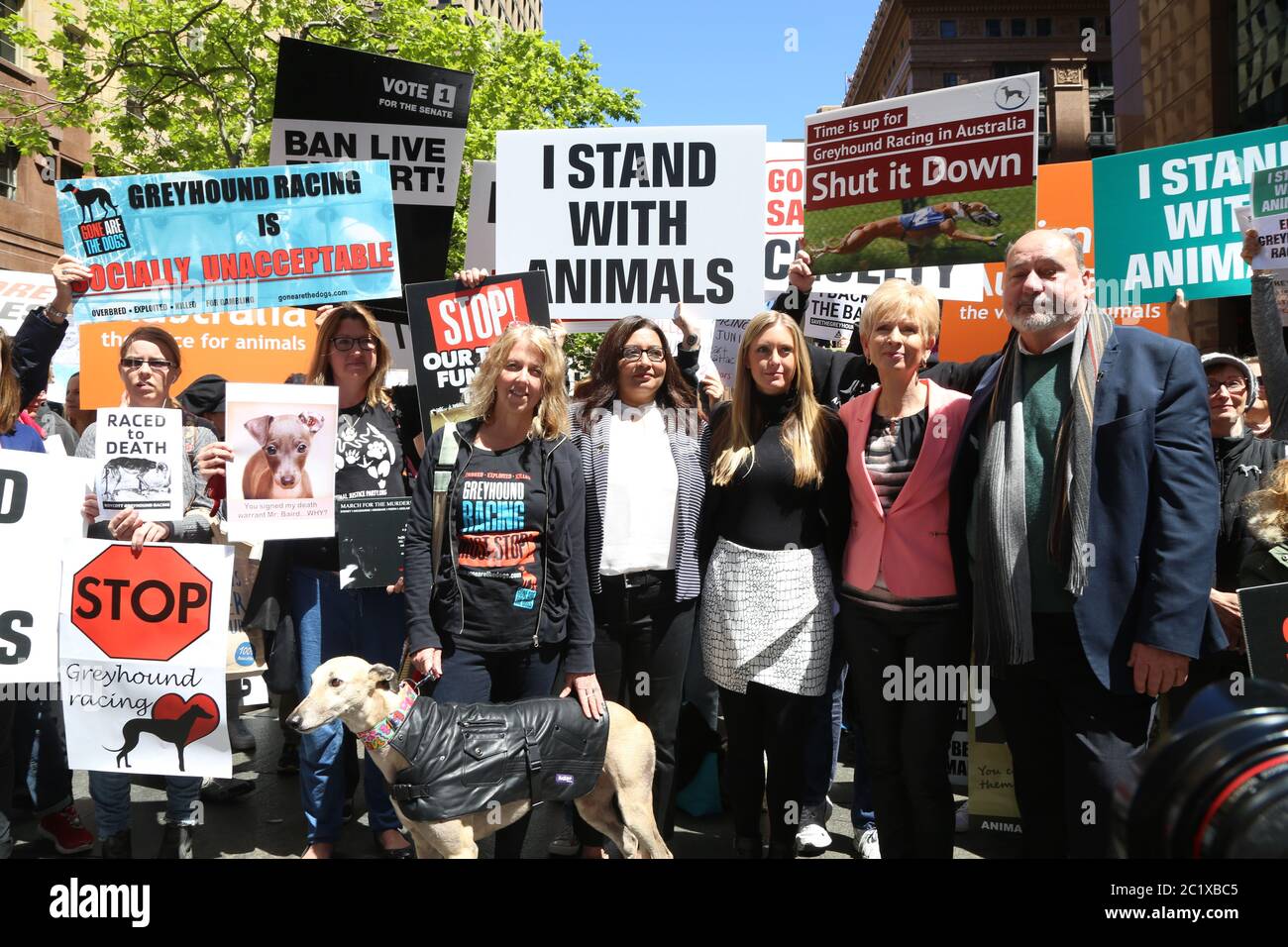 Pictured: At the end of the rally speakers at the rally pose for a ...