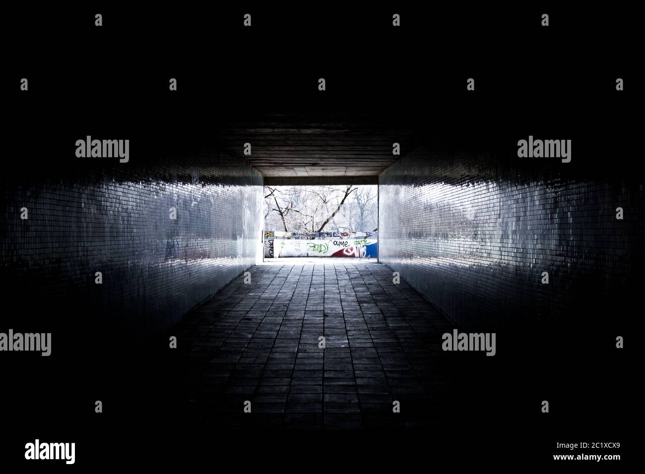 A dark underpass with graffiti on the walls Stock Photo - Alamy