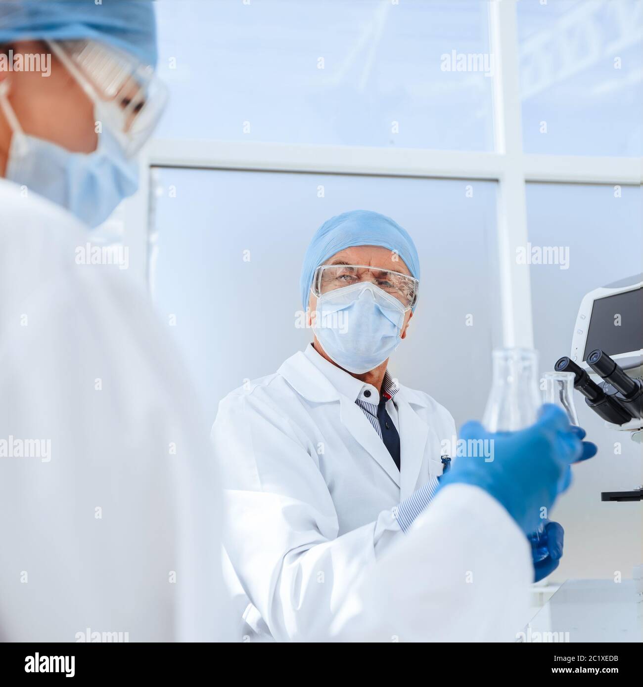 scientists and doctors work in a modern laboratory Stock Photo - Alamy