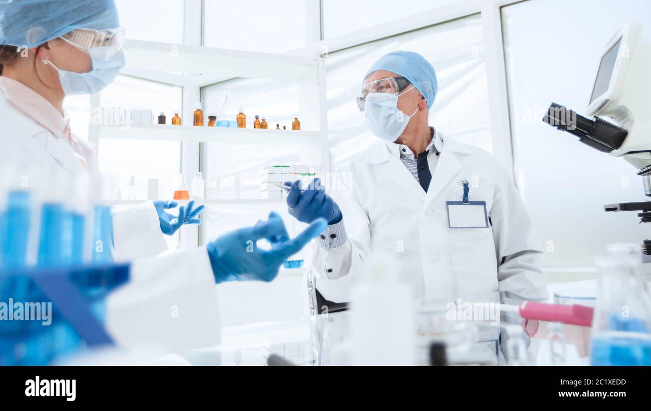 senior scientist arguing about something with his colleague Stock Photo ...